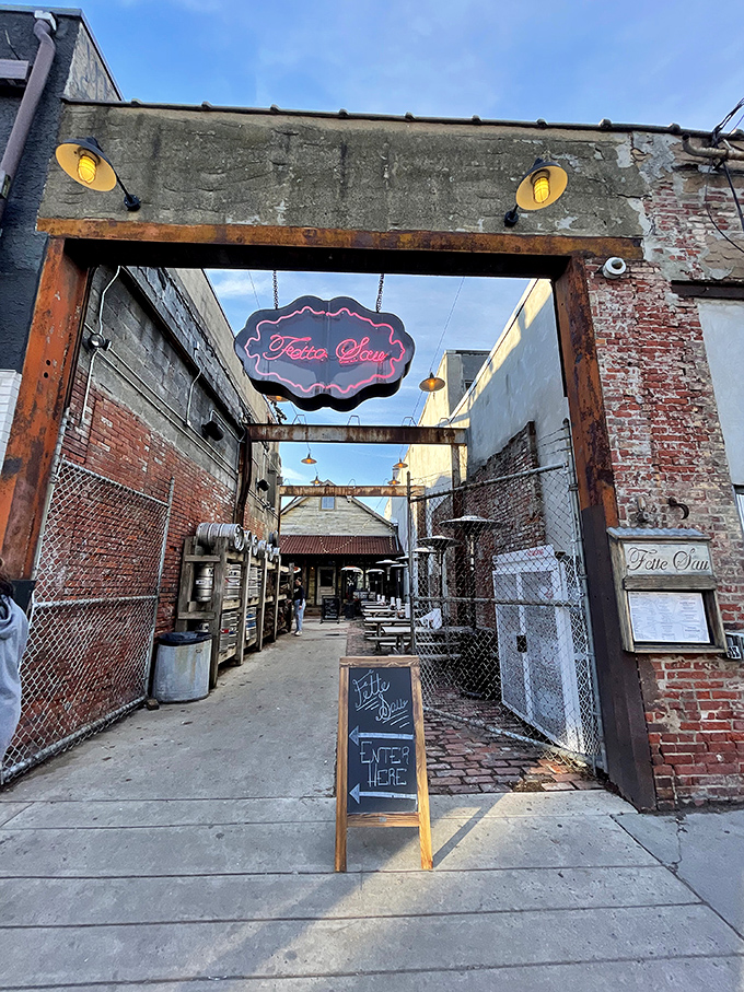 Rustic charm meets urban cool at Fette Sau's weathered wooden exterior. Those picnic tables practically whisper "sit down and stay awhile."