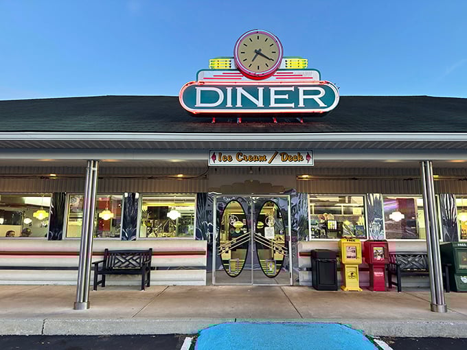 The neon-crowned time machine beckons hungry travelers with its gleaming promise of classic Americana. This isn't just a sign—it's a portal to simpler, more delicious times.