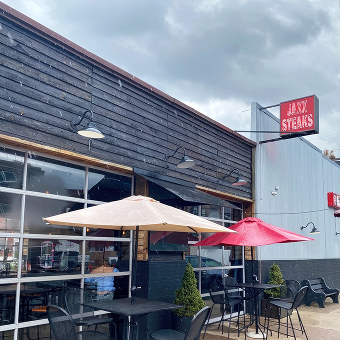 The unassuming black exterior of Jaxx Taproom stands like a culinary speakeasy, its red sign a beacon for sandwich seekers throughout Pennsylvania.