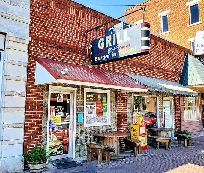 The brick facade and vintage sign of The Grill in Hawkinsville promises what every great roadside find should: the "Best Burger in Town" isn't just a claim&mdash;it's a mission statement.