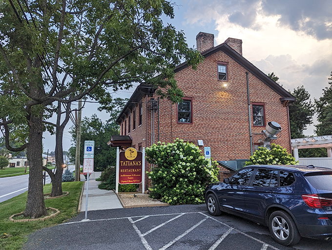 Tatiana's burgundy sign against classic brick architecture creates the perfect first impression—like finding a European postcard come to life in central Pennsylvania.
