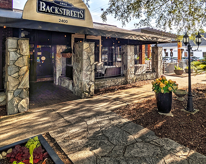The stone facade of Backstreets welcomes you like an old friend who happens to make incredible food. Sunlight dapples the entrance, promising culinary delights within.