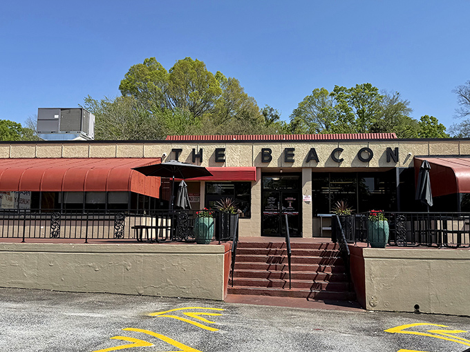The iconic red awnings of The Beacon beckon hungry travelers like a lighthouse for the famished. Southern comfort food paradise awaits.