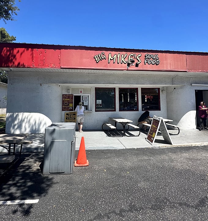The unassuming red-topped exterior of Big Mike's Soul Food &ndash; where culinary magic hides behind modest walls, proving the best treasures don't need fancy packaging.