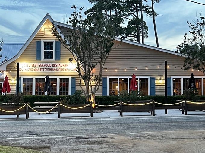 The unassuming exterior of Lee's Inlet Kitchen stands proudly with its "Best Seafood Restaurant" banner &ndash; like finding a treasure chest disguised as a tackle box.