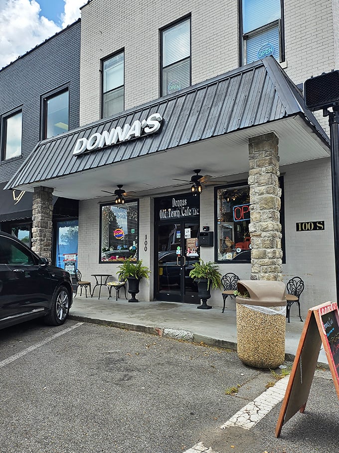 The welcoming facade of Donna's Old Town Cafe beckons hungry travelers with its charming stone columns and metal awning&mdash;small-town Tennessee hospitality in architectural form.