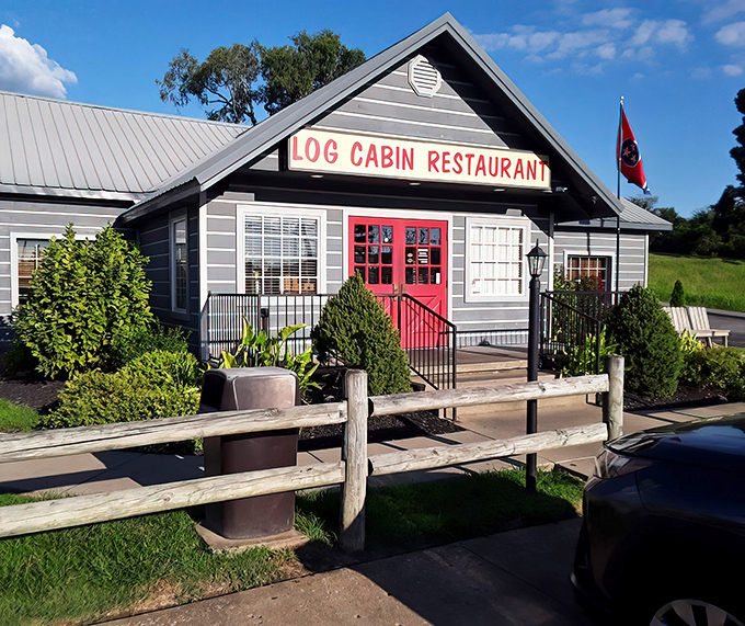 The iconic gray exterior with that unmistakable red door beckons hungry travelers like a lighthouse for comfort food enthusiasts.