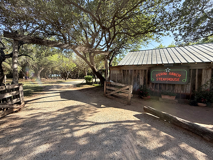 The entrance to paradise isn't pearly gates &ndash; it's a weathered wooden sign and gravel path leading to Texas beef nirvana.