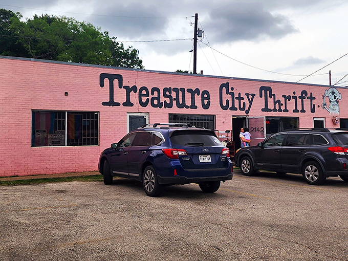 The bubblegum-pink exterior of Treasure City Thrift stands out like a flamingo in a penguin parade, beckoning bargain hunters with its vibrant charm.