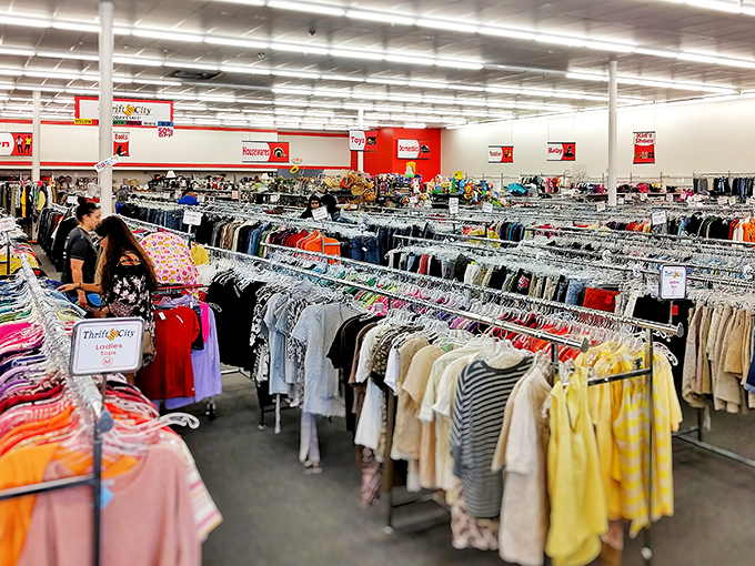 The women's section is organized with military precision. Color-coded racks make finding that perfect blouse easier than locating Texas on a map.
