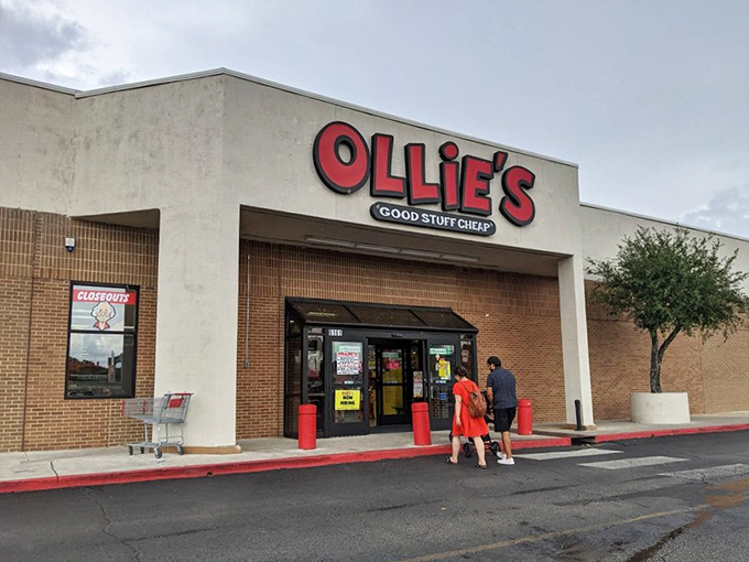 The iconic red Ollie's sign beckons bargain hunters like a retail lighthouse, promising treasures within those unassuming walls.