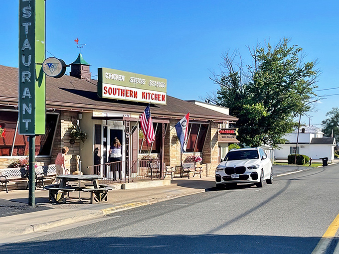 That classic roadside restaurant charm is on full display, complete with patriotic bunting and a sign that promises exactly what you're craving: chicken, steaks, and seafood.