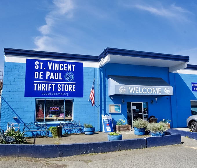 The iconic blue exterior of St. Vincent de Paul stands like a beacon of bargain possibilities in Tacoma. One step inside and your wallet breathes a sigh of relief.