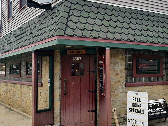 The unassuming exterior of Frankie's Pub & Grill hides a culinary treasure within. That stone facade and vintage sign promise authentic Wisconsin hospitality without pretense.