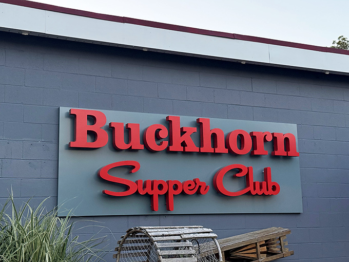 The iconic red signage of Buckhorn Supper Club stands out against the gray exterior, with lobster traps hinting at the treasures waiting inside.