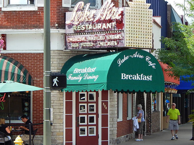 The iconic green awnings and vintage signage of Lake-Aire Restaurant stand as a beacon for breakfast lovers in downtown Lake Geneva. Wisconsin comfort food at its most authentic.