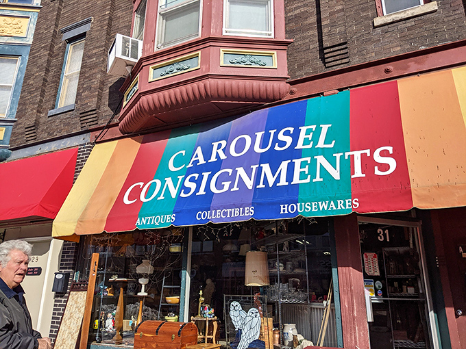 The rainbow-striped awning of Carousel Consignments beckons like a retail oasis in downtown Janesville, promising treasures for every budget and taste.