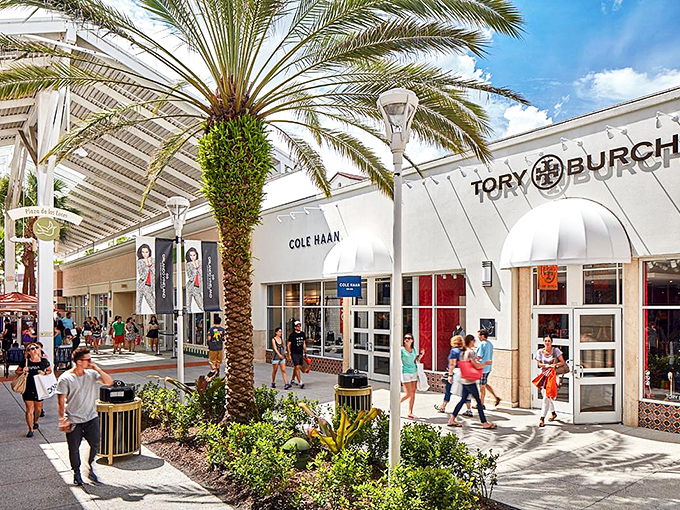 Mediterranean-inspired architecture meets retail therapy paradise. Palm trees sway as shoppers hunt for treasures under Florida's blue skies at Orlando Vineland Premium Outlets.