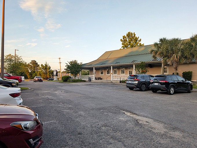 The unassuming exterior promises what fancy restaurants rarely deliver: food that makes you forget your manners and reach for seconds without apology.