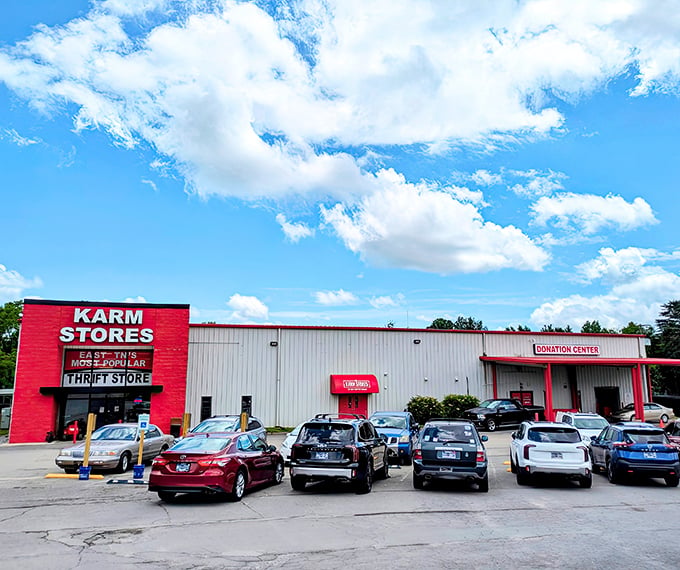 The bright red facade of KARM Stores stands out like a beacon for bargain hunters, promising treasures within its unassuming exterior.