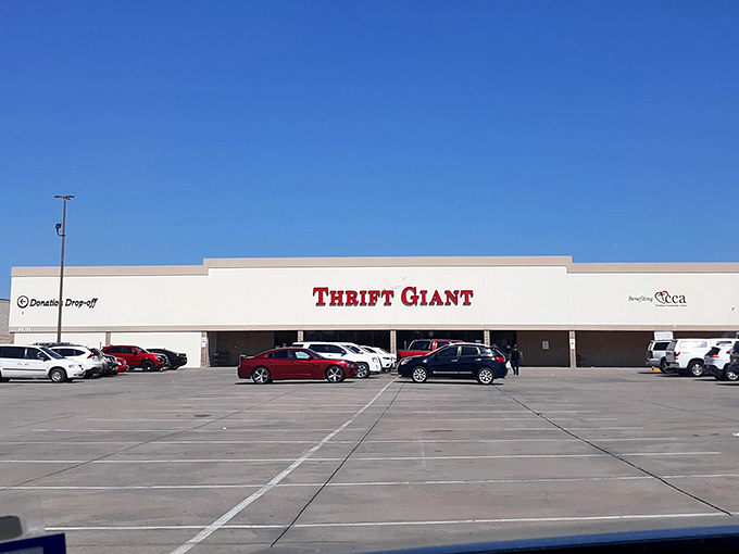The bold red letters against beige stucco promise adventure within. Like a treasure chest waiting to be unlocked, Thrift Giant beckons bargain hunters. 