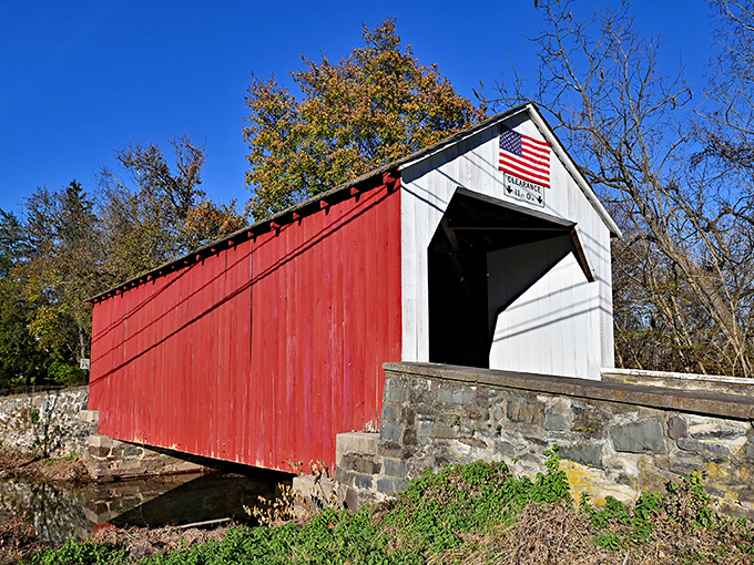 The classic white and red Erwinna Covered Bridge stands like a time machine disguised as architecture, beckoning travelers to slow down and appreciate Pennsylvania craftsmanship.