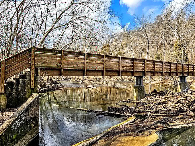 The wooden bridge spanning the Little Miami River offers more than just passage &ndash; it's a front-row seat to nature's quiet symphony of flowing water and rustling leaves.