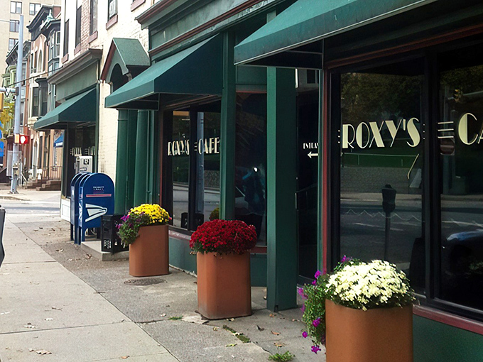 The iconic green awnings and colorful flower planters of Roxy's Cafe create an inviting oasis on North 3rd Street in downtown Harrisburg.