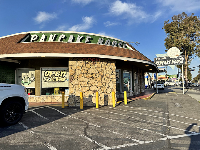 That stone facade and vintage sign whisper promises of breakfast done right, no fancy frills needed.