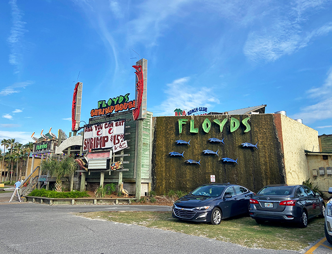 Floyd's unmistakable exterior beckons hungry travelers with its bold promise of all-you-can-eat shrimp and weathered coastal charm that screams "authentic Florida seafood experience."