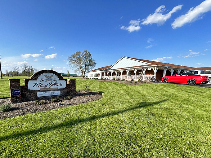Welcome to simplicity heaven! Mary Yoder's brick sign stands proudly against Ohio's blue sky, promising comfort food that'll make your cardiologist wince and your soul rejoice.