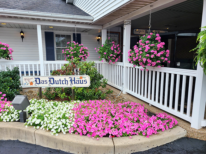 The welcoming front porch of Das Dutch Haus, where hanging baskets of pink flowers practically scream "Come eat something delicious!"