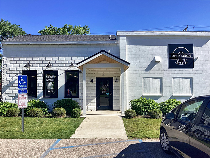 The unassuming white brick exterior of Red Coach Donuts proves once again that culinary treasures often hide in plain sight.