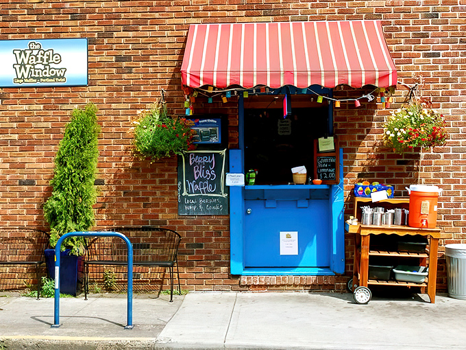 A literal window to waffle paradise. The cheerful blue frame and red awning beckon hungry Portlanders like a breakfast lighthouse.