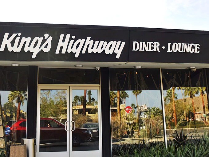 Palm trees reflected in the windows create a quintessential Palm Springs tableau, where nature and architecture perform their daily dance under the desert sun.