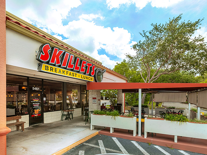 The bright red "SKILLETS" sign beckons like a breakfast lighthouse, promising refuge from hunger and mediocre morning meals.