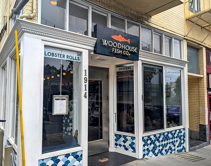 The blue-tiled facade of Woodhouse Fish Co. stands like a maritime beacon on Fillmore Street, promising seafood treasures within those unassuming walls.