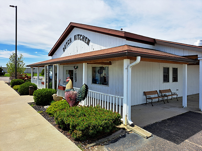 The unassuming white exterior of Dutch Kitchen welcomes hungry travelers like a beacon of breakfast hope in Amish Country, promising homestyle cooking without pretension.