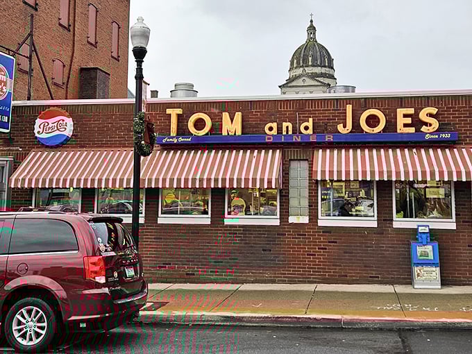 The iconic yellow letters of Tom & Joe's glow against Altoona's skyline, a beacon of comfort food that's been drawing hungry locals since 1945.