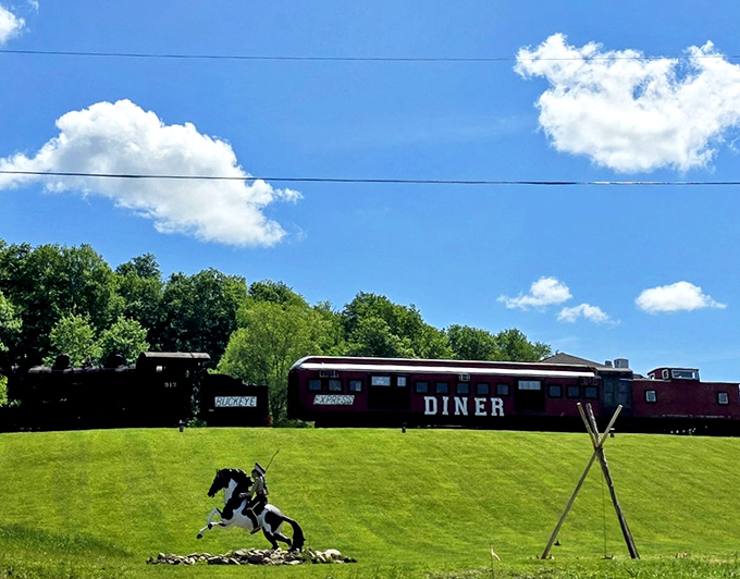 All aboard for flavor! The scarlet railcar of Buckeye Express Diner gleams against the Ohio sky, promising a journey through comfort food paradise.