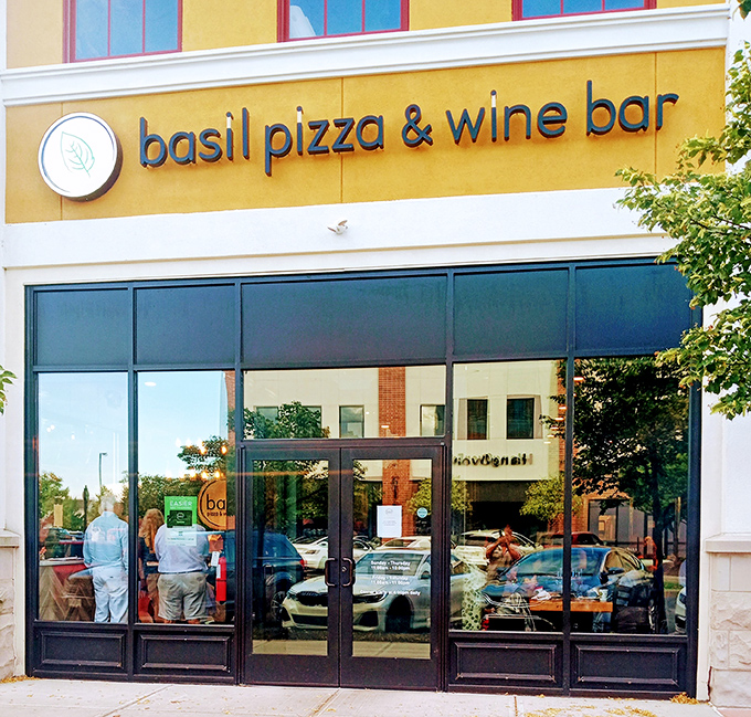 The golden facade of Basil Pizza & Wine Bar beckons like a culinary lighthouse on Perrysburg's main street, promising Italian delights within.