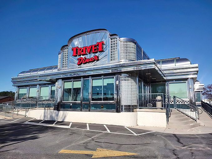 Gleaming like a chrome-plated time machine, Trivet Diner's Art Deco exterior promises a journey back to when conversations happened face-to-face and calories weren't counted.