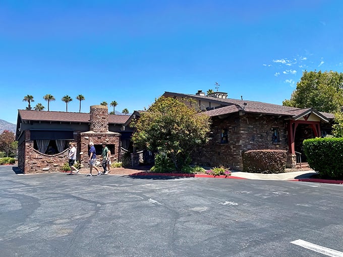 The stone facade of The Derby stands like a culinary fortress in Arcadia, promising carnivorous delights within those unassuming walls.