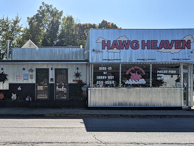 The unassuming exterior of Hawg Heaven stands like a beacon of barbecue hope on Kokomo's Defenbaugh Street, promising smoky delights within its humble walls.