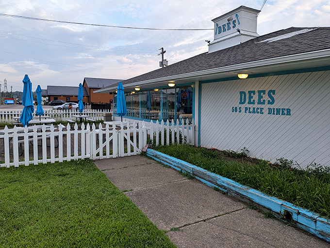 That iconic turquoise exterior isn't just a color choice&mdash;it's a beacon calling to hungry travelers like a mid-century lighthouse guiding ships to comfort food harbor.