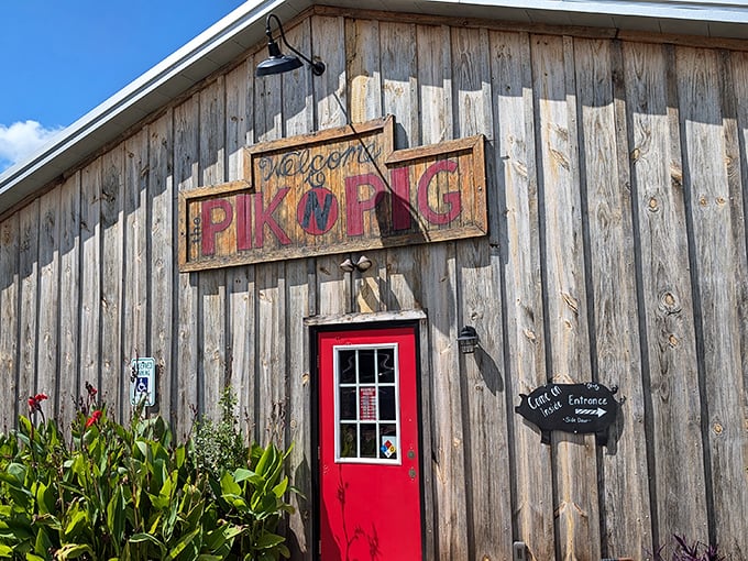 That hand-painted sign says it all&mdash;welcome to barbecue paradise. The red door practically winks at you, promising smoky treasures within.