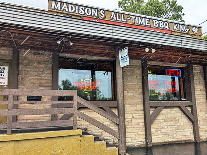 Madison's self-proclaimed BBQ royalty stands proud with its rustic wooden porch and stone facade, beckoning hungry travelers like a smoky siren call.