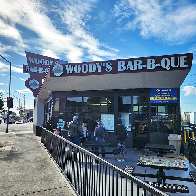 The iconic Woody's Bar-B-Que storefront stands like a beacon of smoky promise on Crenshaw Boulevard, drawing BBQ pilgrims from across Los Angeles.
