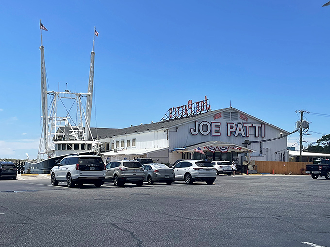 The iconic white building with bold red lettering announces your arrival at seafood paradise. No fancy frills needed when the goods inside speak for themselves.