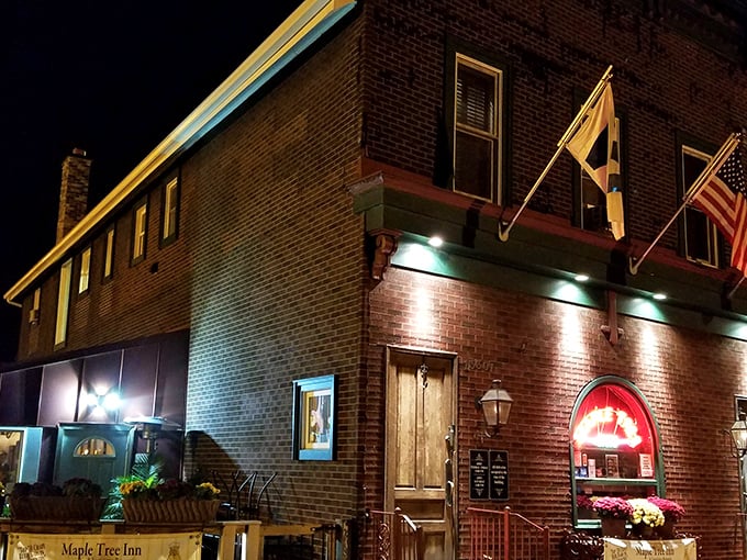 At night, the brick exterior transforms into a beacon for hungry souls seeking Southern comfort far from the bayou.